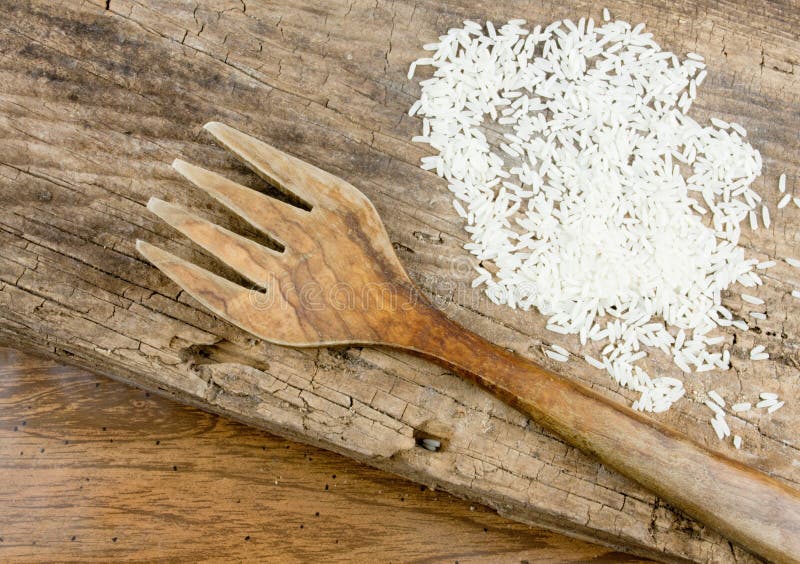 Wooden Background with Fork and Rice Stock Image - Image of grain ...