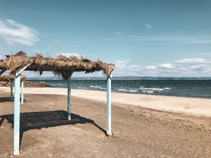 Wooden Bamboo Lounge with a Thatched Roof on the Beach Stock Photo ...