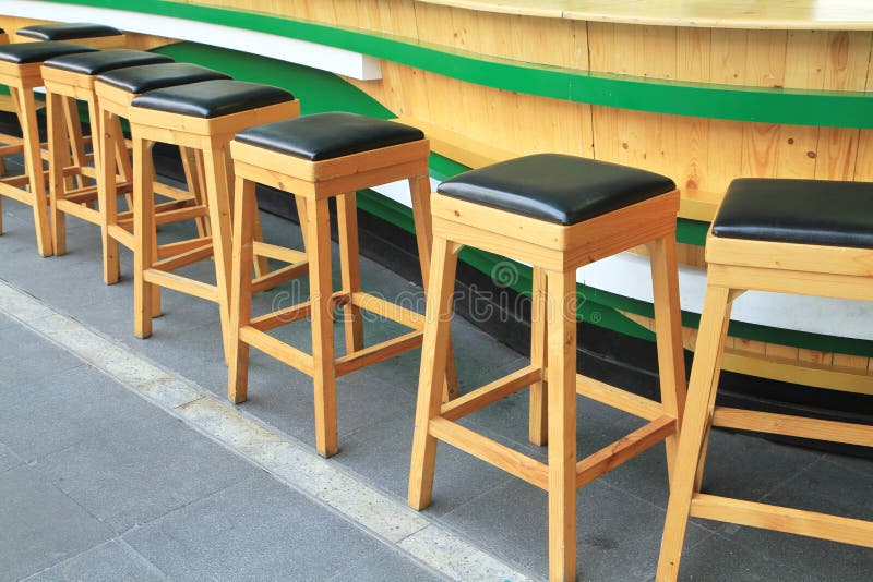 Wooden bar stools stock photo. Image of coctail, deck - 75048000