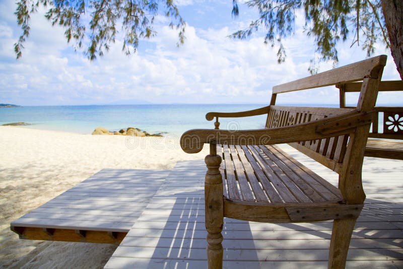 Wooden Beach Bench and the Sea Stock Photo - Image of mini, bench: 25733612