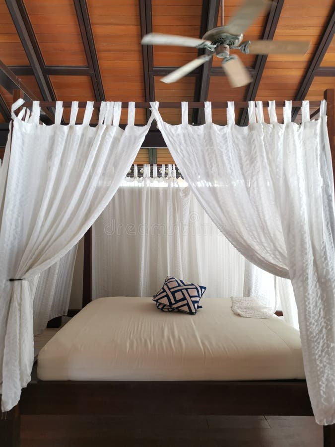 Wooden Bed with White Mosquito Netting. Stock Image - Image of home ...