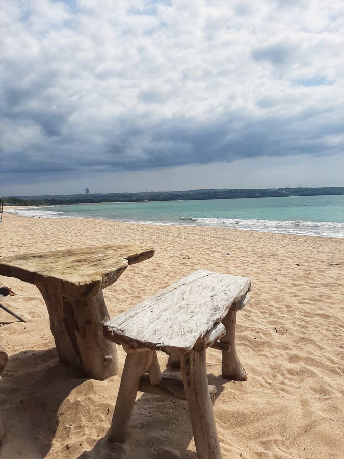 Wooden bench by the beach stock image. Image of table - 207188461