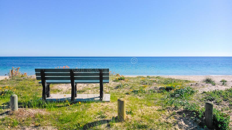 Wooden bench by the beach stock image. Image of tranquil - 127290697