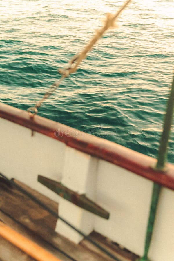 A Wooden Bench is on the Side of a Boat in the Ocean Stock Image ...