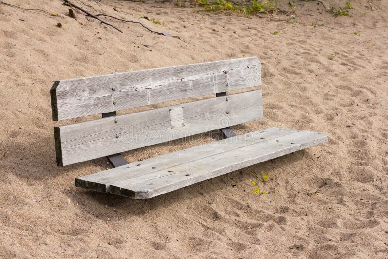 Wooden Bench Buried in the Sand Stock Photo - Image of covered, bench ...