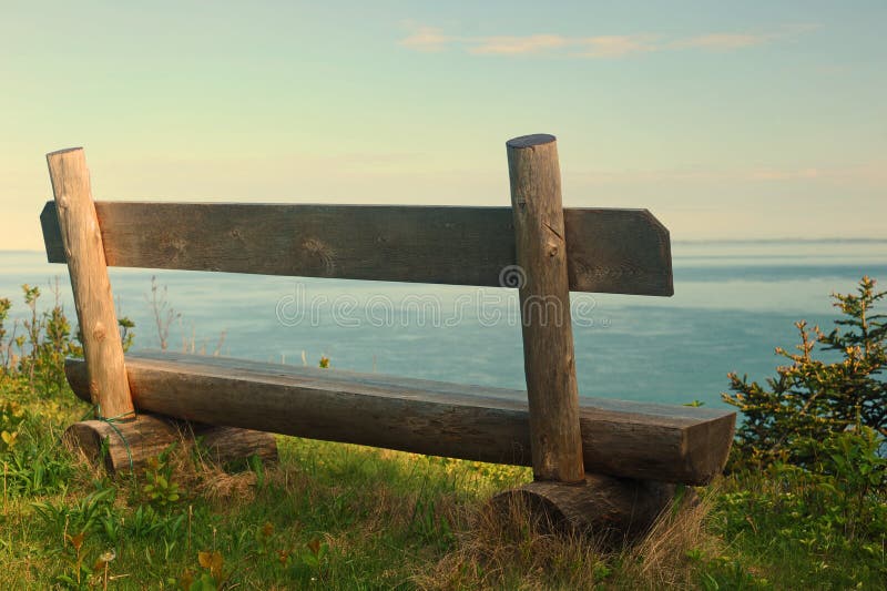Wooden bench on cliff edge stock photo. Image of background - 94778634