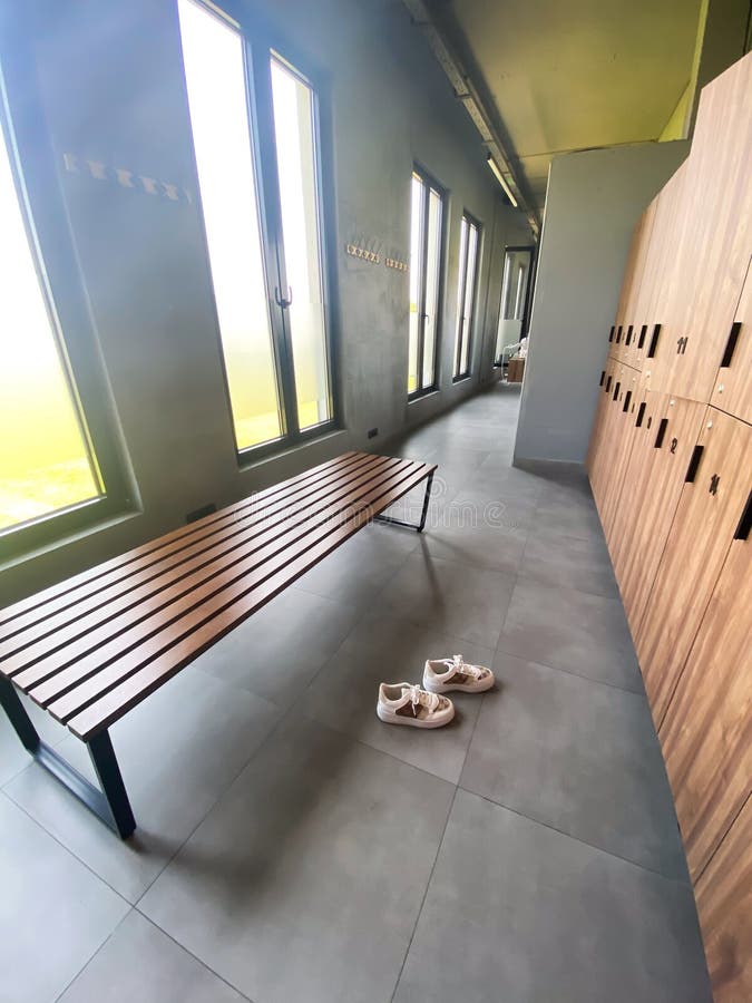 Empty Gym Locker Room with Wooden Benches and Lockers Stock Image ...