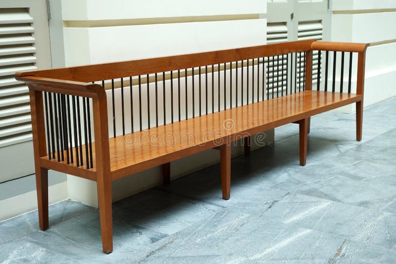 Wooden Bench in Front of a Wall Stock Photo - Image of park, rest ...