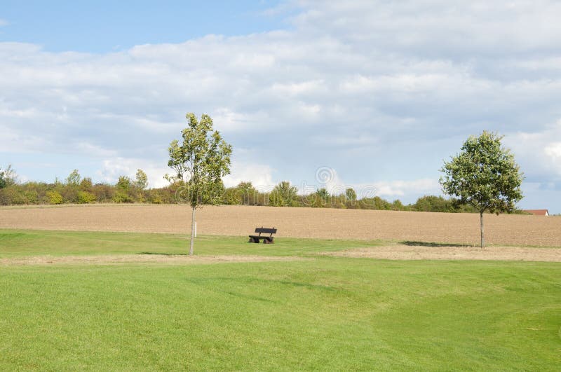 A Wooden Bench at a Golf Course in Germany Stock Photo - Image of ...