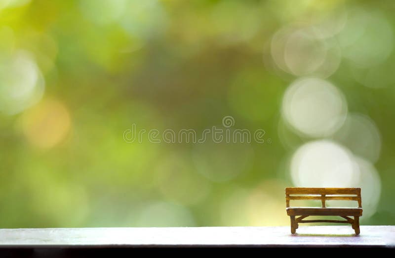 The Wooden Bench with Green Tree Bokeh in the Background for Wallpaper ...