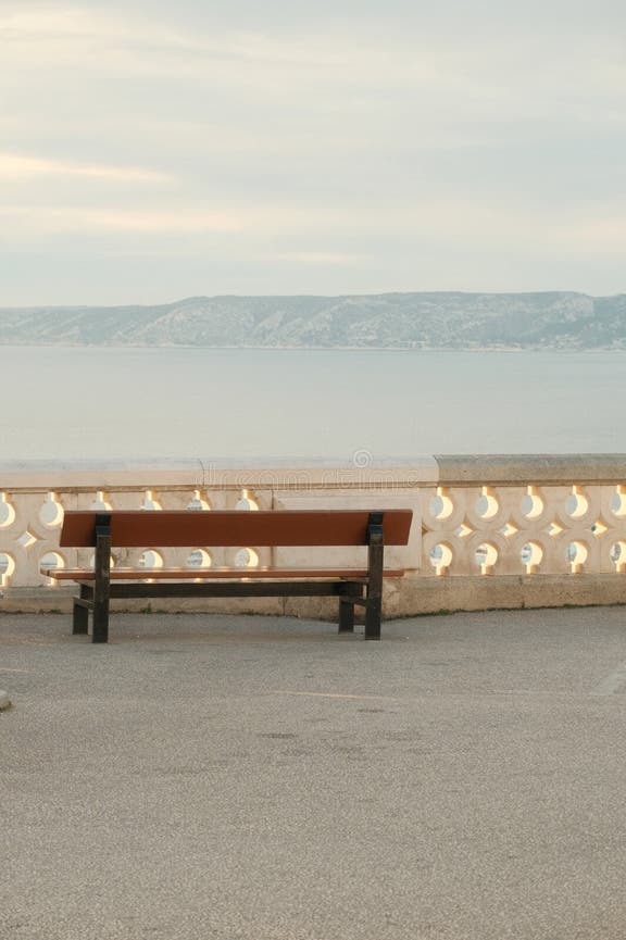 Wooden Bench by the Lake with a Stone Railing Stock Image - Image of ...