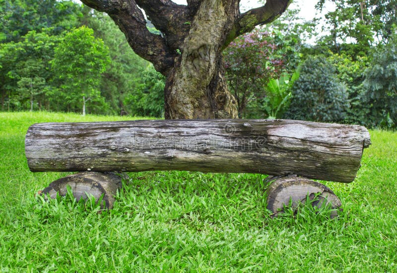 Wooden Bench Made of Tree Trunks Stock Photo - Image of cross, empty ...