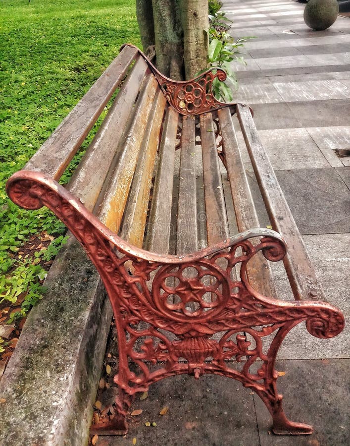 Wooden Bench with Metal Structure in the Park . Vintage Wooden Bench ...