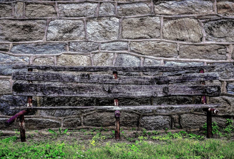 Wooden Bench Near a Rock Wall Stock Image - Image of white, garden ...