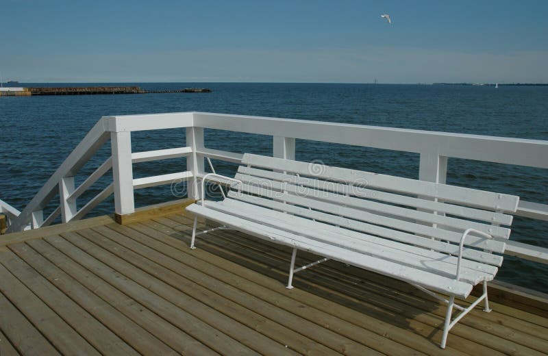 Wooden bench on pier stock photo. Image of seaside, peace - 487484