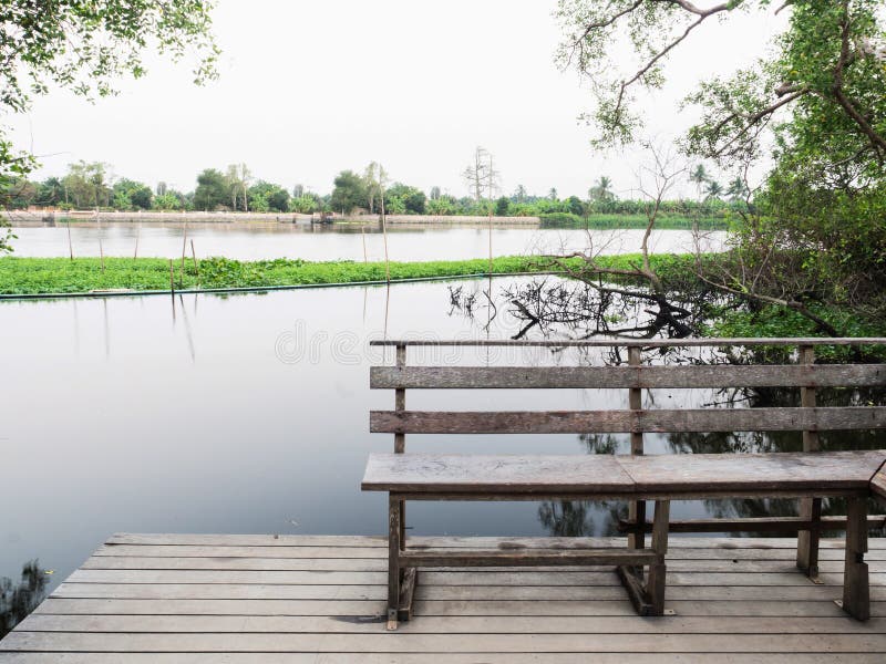 Wooden Bench on Riverside with Rural Scene Stock Image - Image of river ...