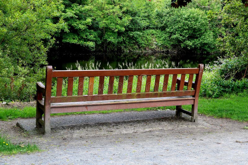 Wooden Bench Seat on a Country Riverside Footpath Stock Image - Image ...