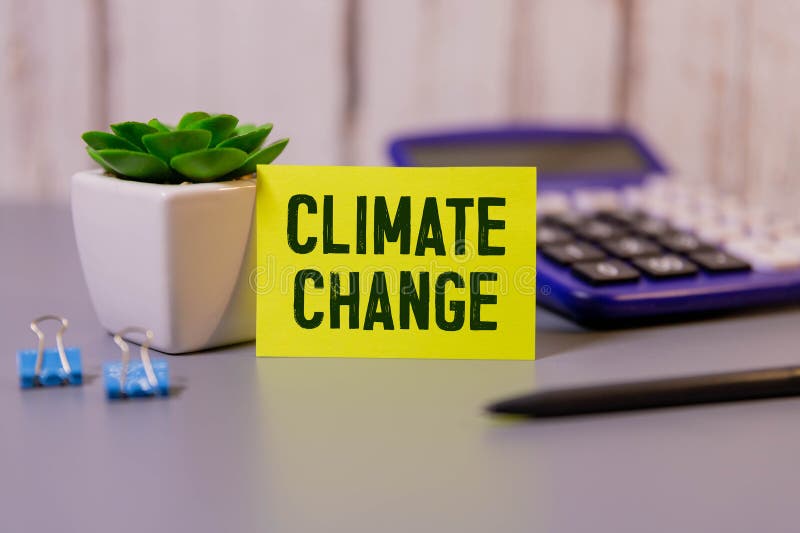 Wooden Block with CLIMATE CHANGE Text on Grass Background ...