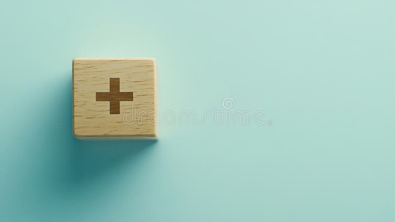 Wooden Block with a Plus Symbol on a Light Blue Background Representing ...