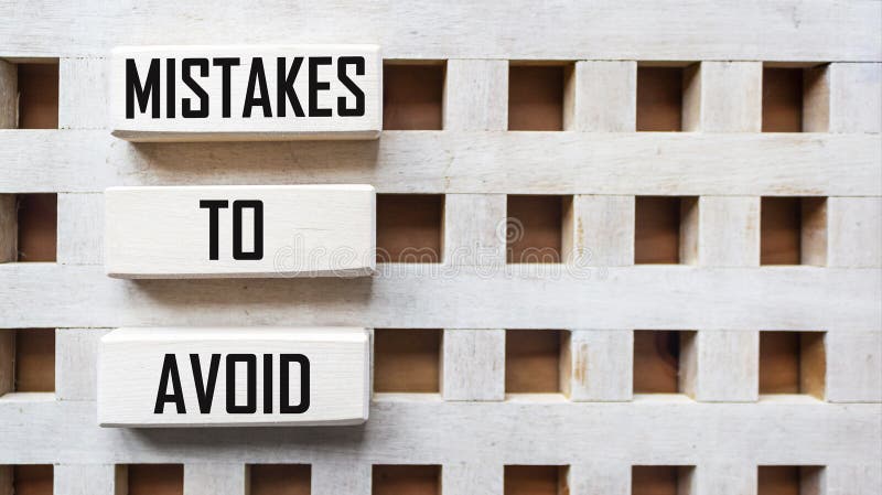 A Wooden Block with Text MISTAKES TO AVOID Stock Image - Image of ...