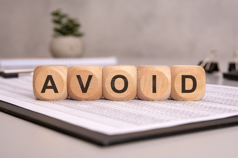 Wooden Blocks with Black Letters Spelling AVOID are Arranged on a ...