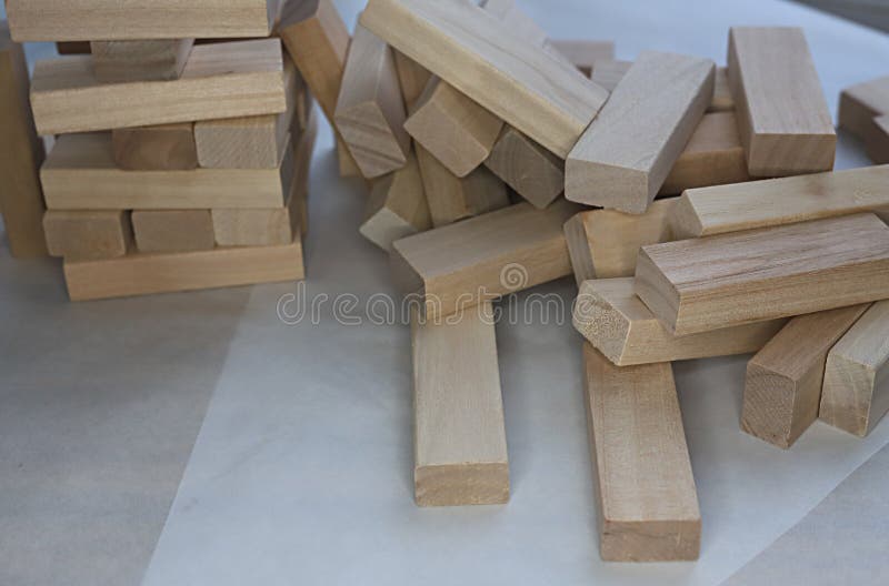Wooden Blocks of the Destroyed Game Tower. Jenga. Concept of ...