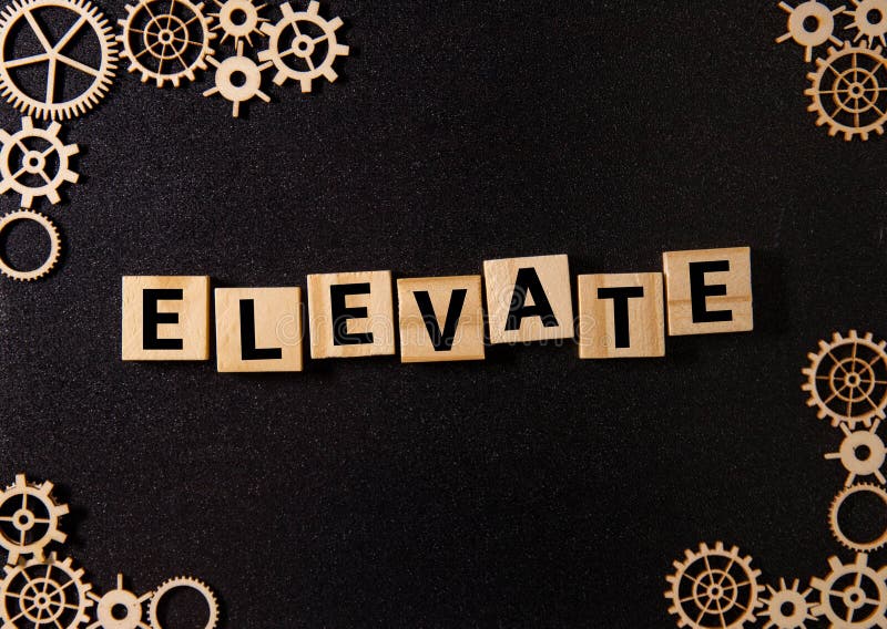 Wooden Blocks Displaying the Word ELEVATE Signify a Concept of Progress ...