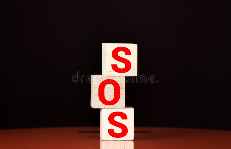 Wooden Blocks Forming the Letters SOS Isolated on White Background ...