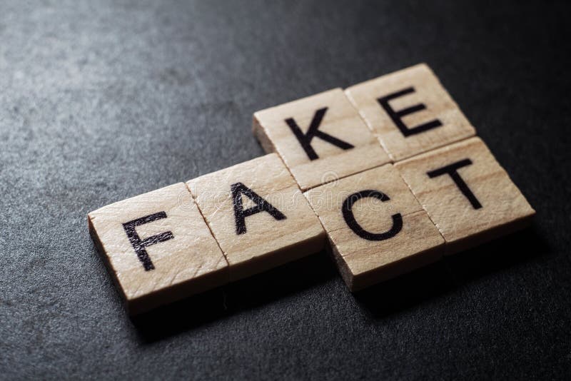 Wooden Blocks Forming Words Fact and Fake on Black Background Stock ...