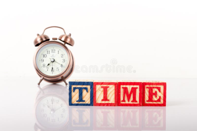 Wooden Blocks with the Letters Time and a Clock Stock Photo - Image of ...