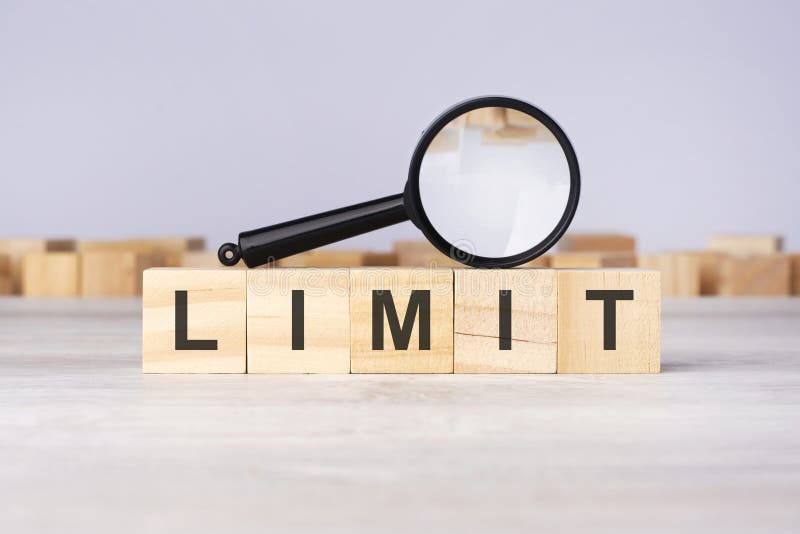Wooden Blocks with a Magnifying Glass Text: LIMIT Stock Photo - Image ...