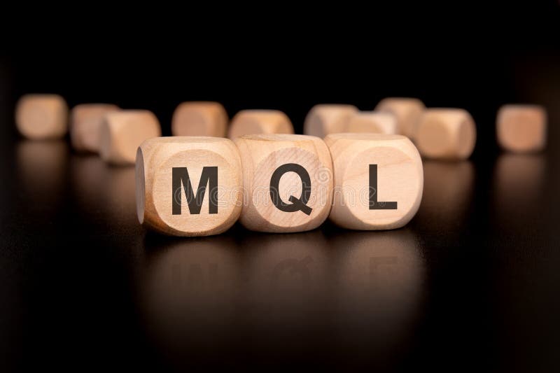 Wooden Blocks with MQL Letters Displayed on a Dark Background for ...