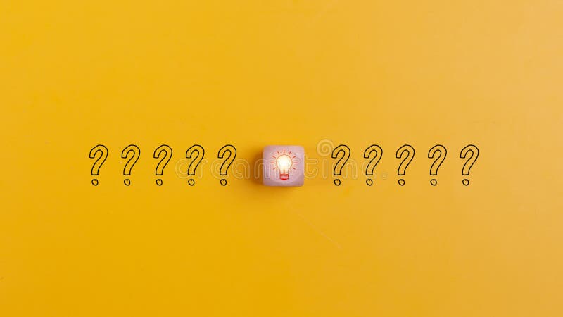 Wooden Blocks with Question Marks and Light Bulb Icons on a Yellow ...