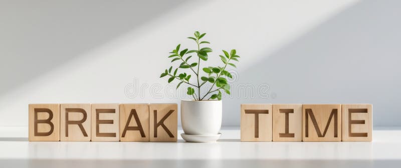 Wooden Blocks Spelling Break Time with a Small Plant Growing from the ...