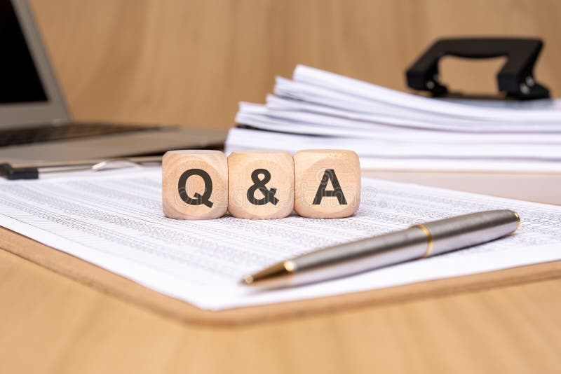 Wooden Blocks Spelling "Q a" on Financial Documents, Symbolizing ...