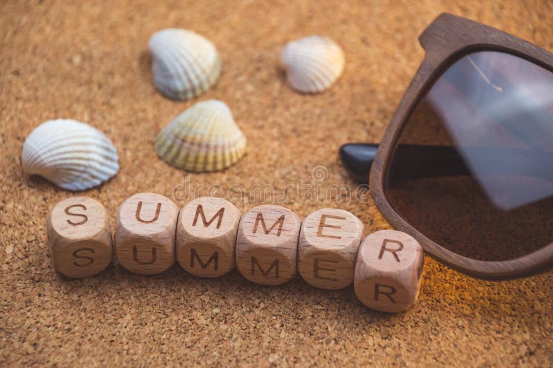 Wooden Blocks Spelling Summer with Seashells and Sunglasses on Cork ...