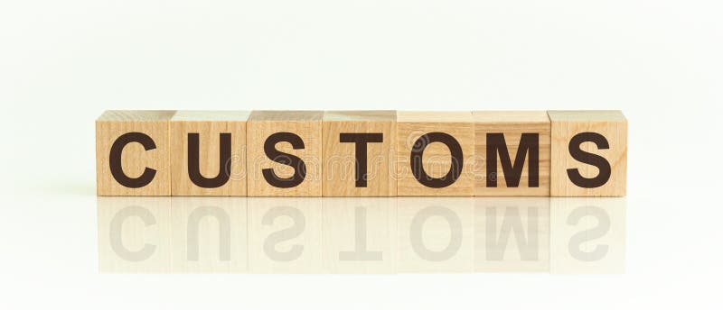 Wooden Blocks with the Text: CUSTOMS. the Text is Written in Black ...