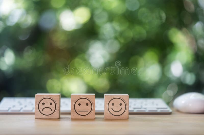 Wooden Blocks with the Three Face Symbol on the Table, Evaluation ...