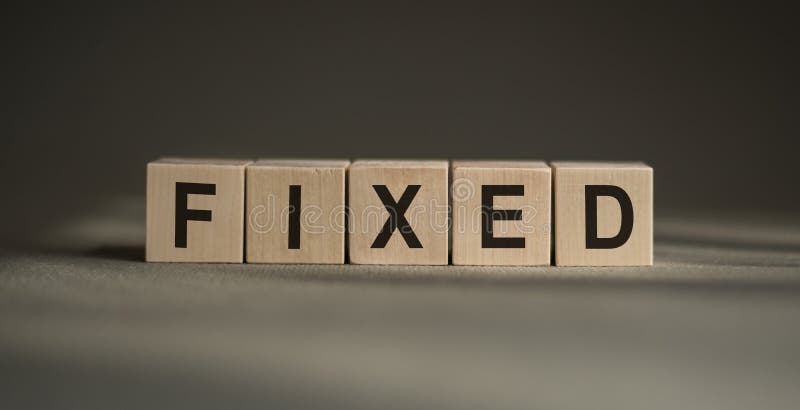 FIXED is Written on Light Wooden Blocks. the Word is Located on a Sheet ...