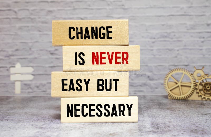 Wooden Blocks with Words & X27;Change is Never Easy but Necessary& X27 ...