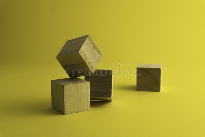 Wooden Blocks on a Yellow Background. Stock Image - Image of cube ...