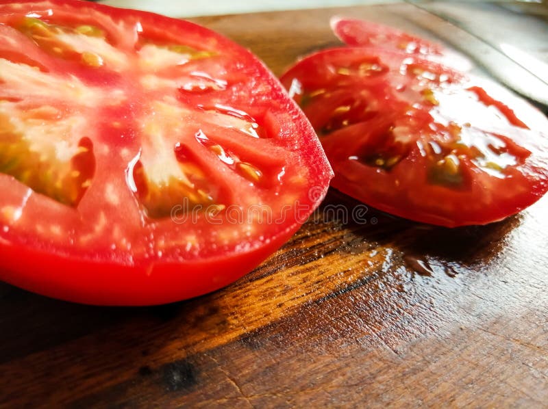 On a Wooden Board Chopped Tomato Stock Image - Image of rings, plant ...