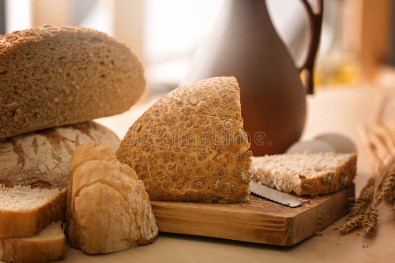 Wooden Board with Cut Bread on Table Stock Image - Image of closeup ...