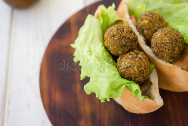 Wooden Board with Falafel in Pita Inside. Stock Photo - Image of meal ...