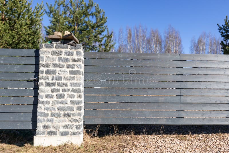 Wooden Board Fence with a Stone and Metal Post in the Middle Stock Photo - Image of landmark ...
