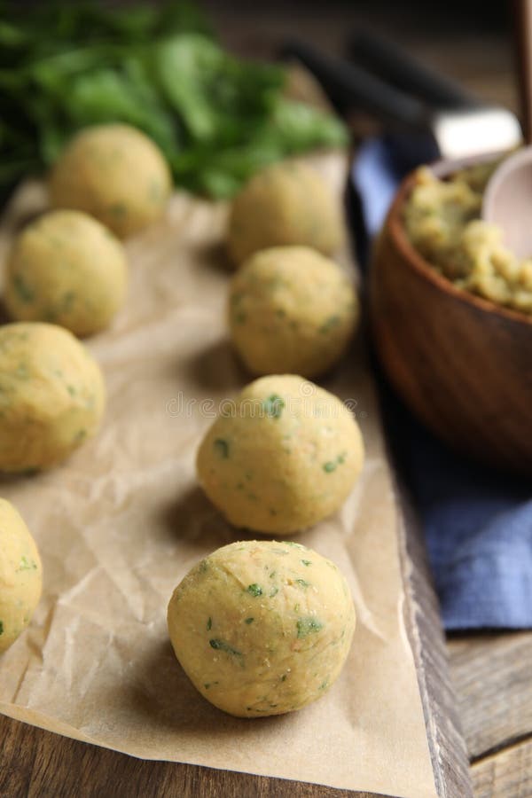Wooden Board with Raw Falafel Balls on Table, Closeup Stock Photo ...