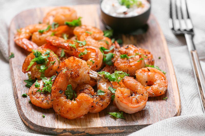 Wooden Board of Tasty Shrimp Tails on Table Stock Photo - Image of ...