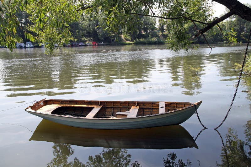 Wooden boat stock image. Image of reflection, tree, water - 38344011