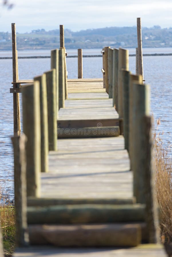 Wooden Boat at Pier on Lake Stock Photo - Image of scene, peaceful ...
