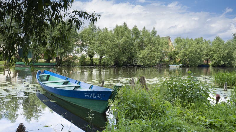Wooden Boat on the River among the Trees Editorial Photography - Image ...